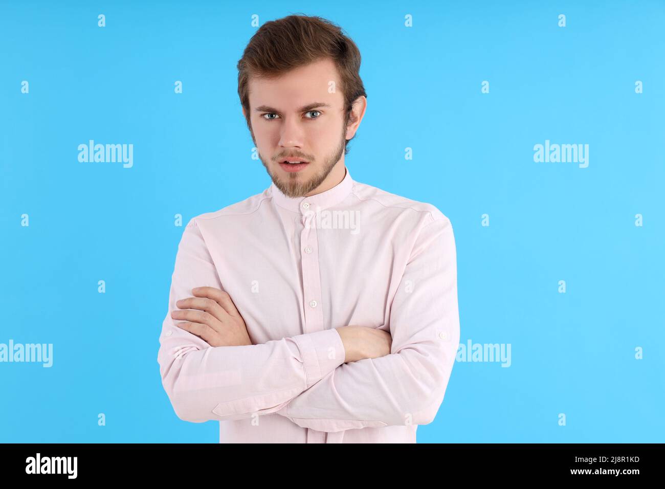 Concept of people, young man on blue background Stock Photo - Alamy