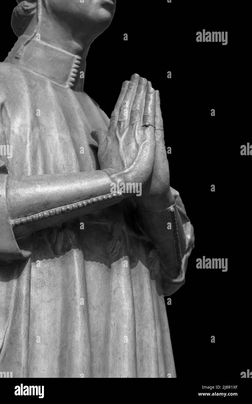 Praying hands with faith in religion and belief in God on black ...
