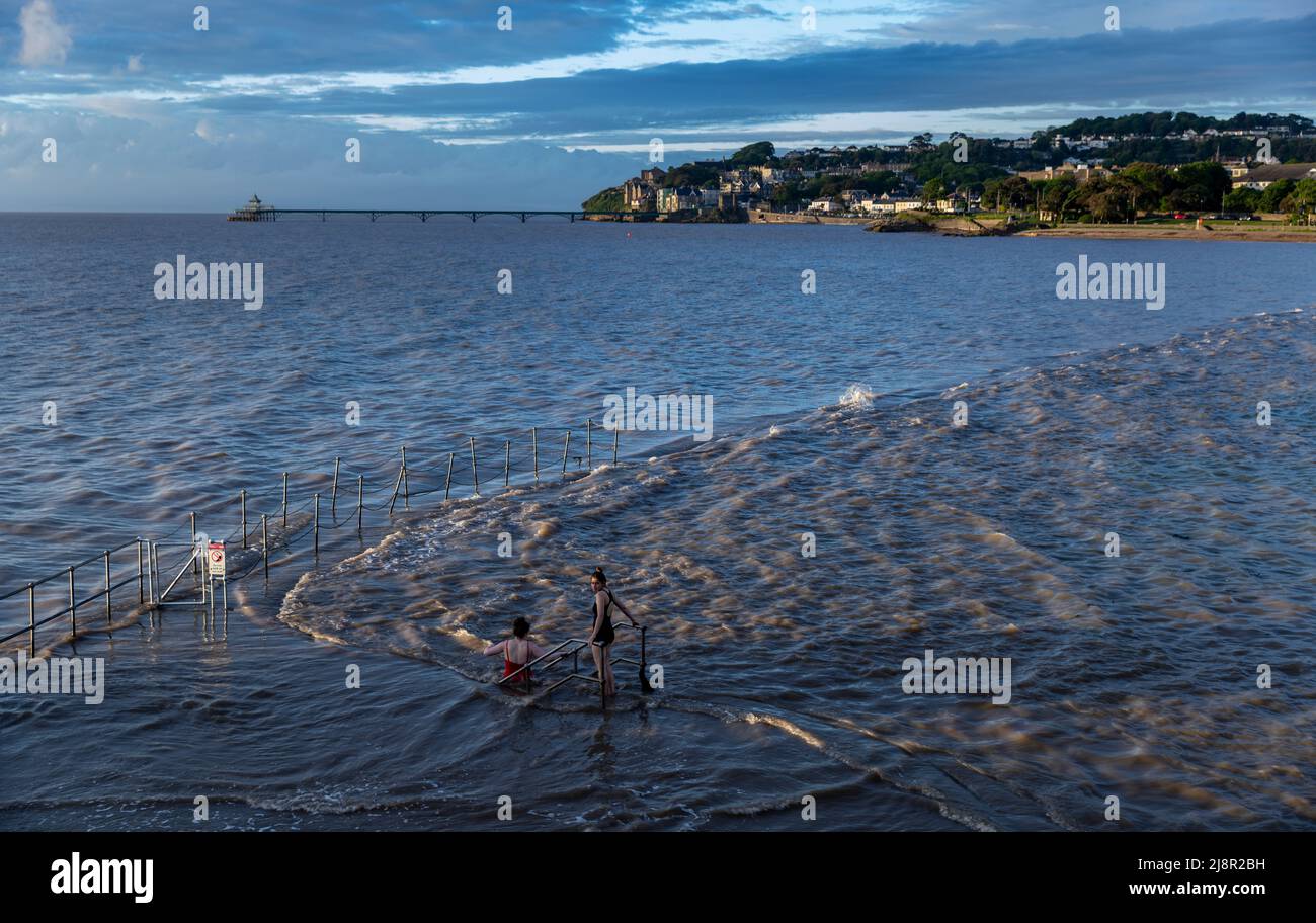 Clevedon Marine Lake, UK. 17th May, 2022. Local swimmer entering the ...