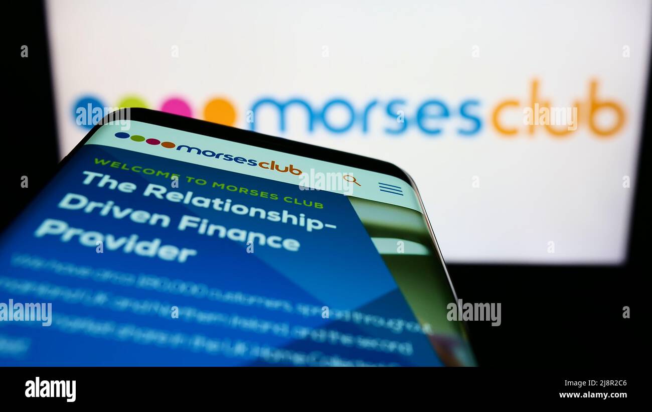 Mobile phone with webpage of British financial company Morses Club plc ...