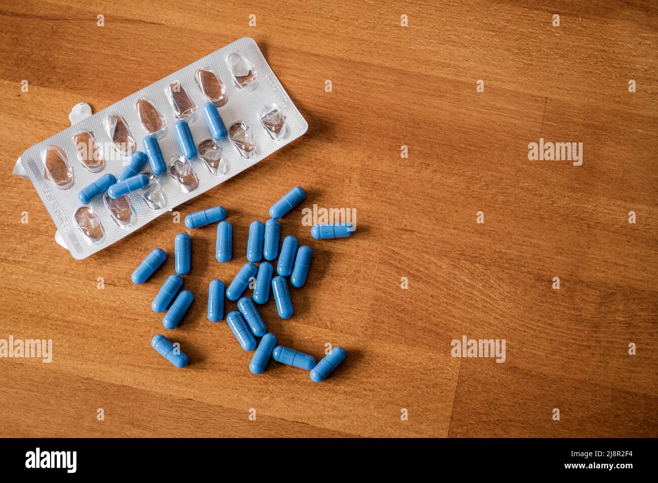 Pile of blue tablets pills Stock Photo - Alamy