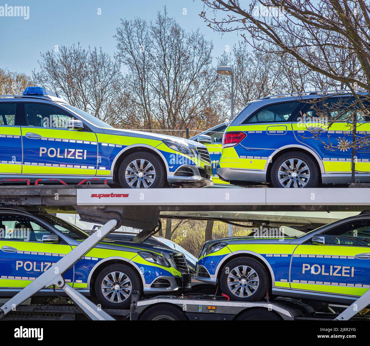 Car transporter with a load of new police cars for Germany Stock Photo ...
