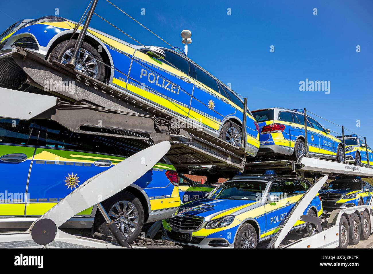 Car transporter with a load of new police cars for Germany Stock Photo ...