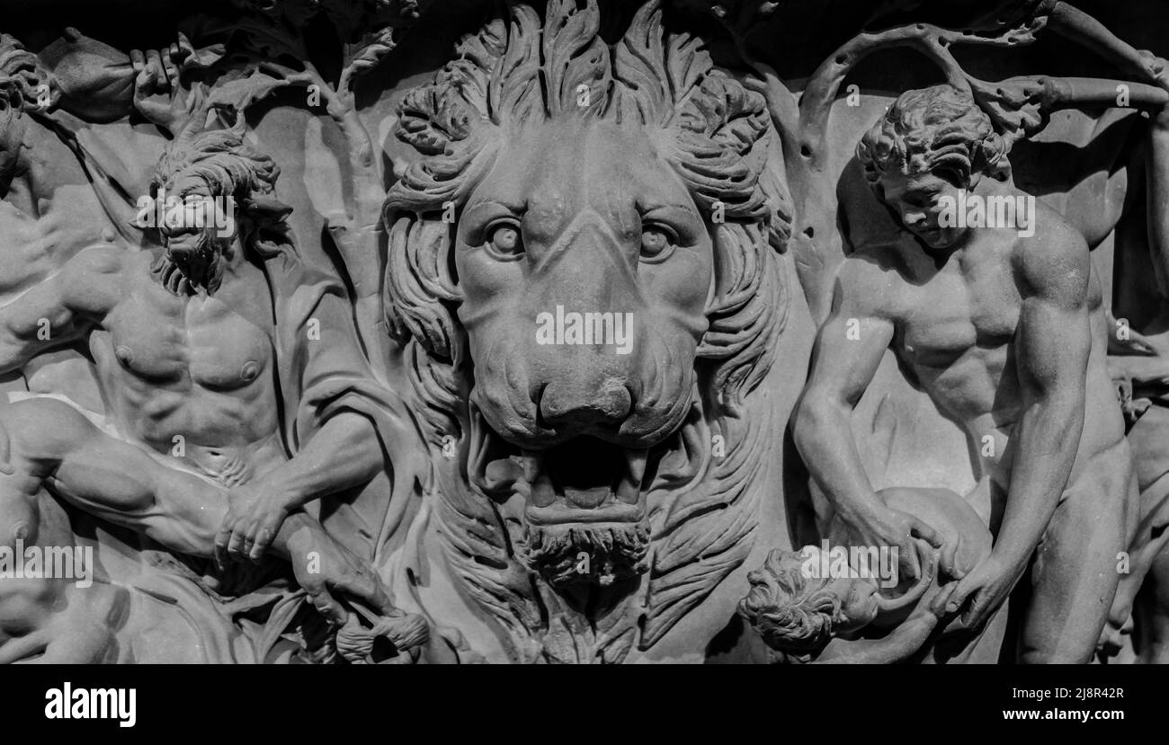 Stone bas-relief of lion and gods Stock Photo - Alamy