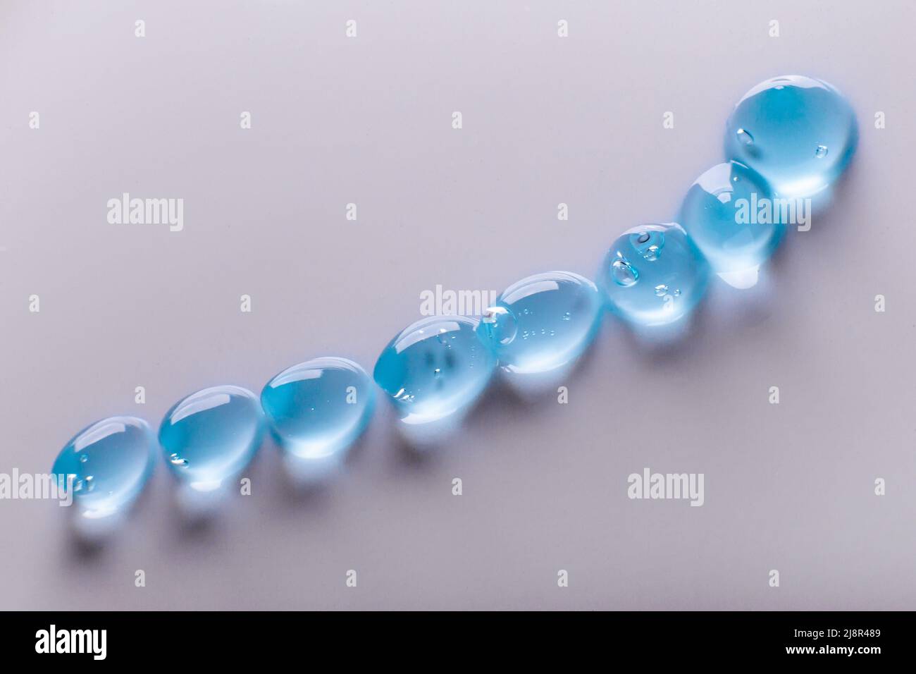 Cream gel transparent cosmetic sample texture with bubbles isolated on ...