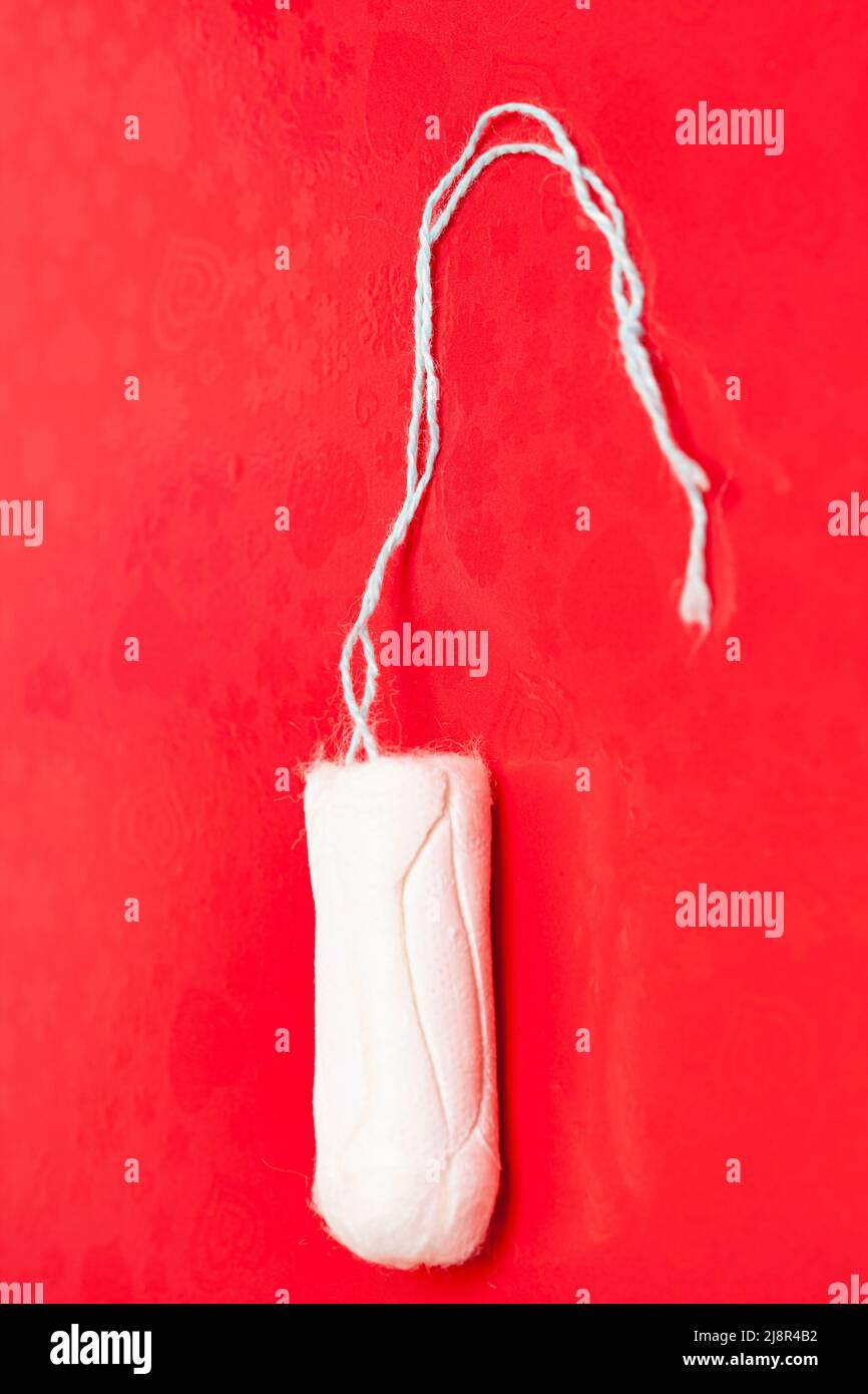 Hygienic tampons on red background, women's health Stock Photo - Alamy