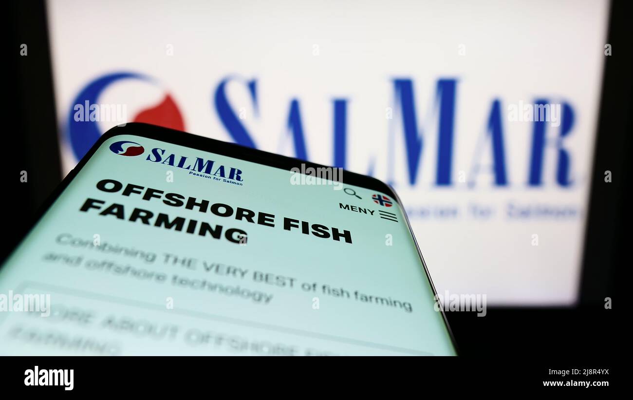 Smartphone with webpage of Norwegian fish farm company SalMar ASA on ...