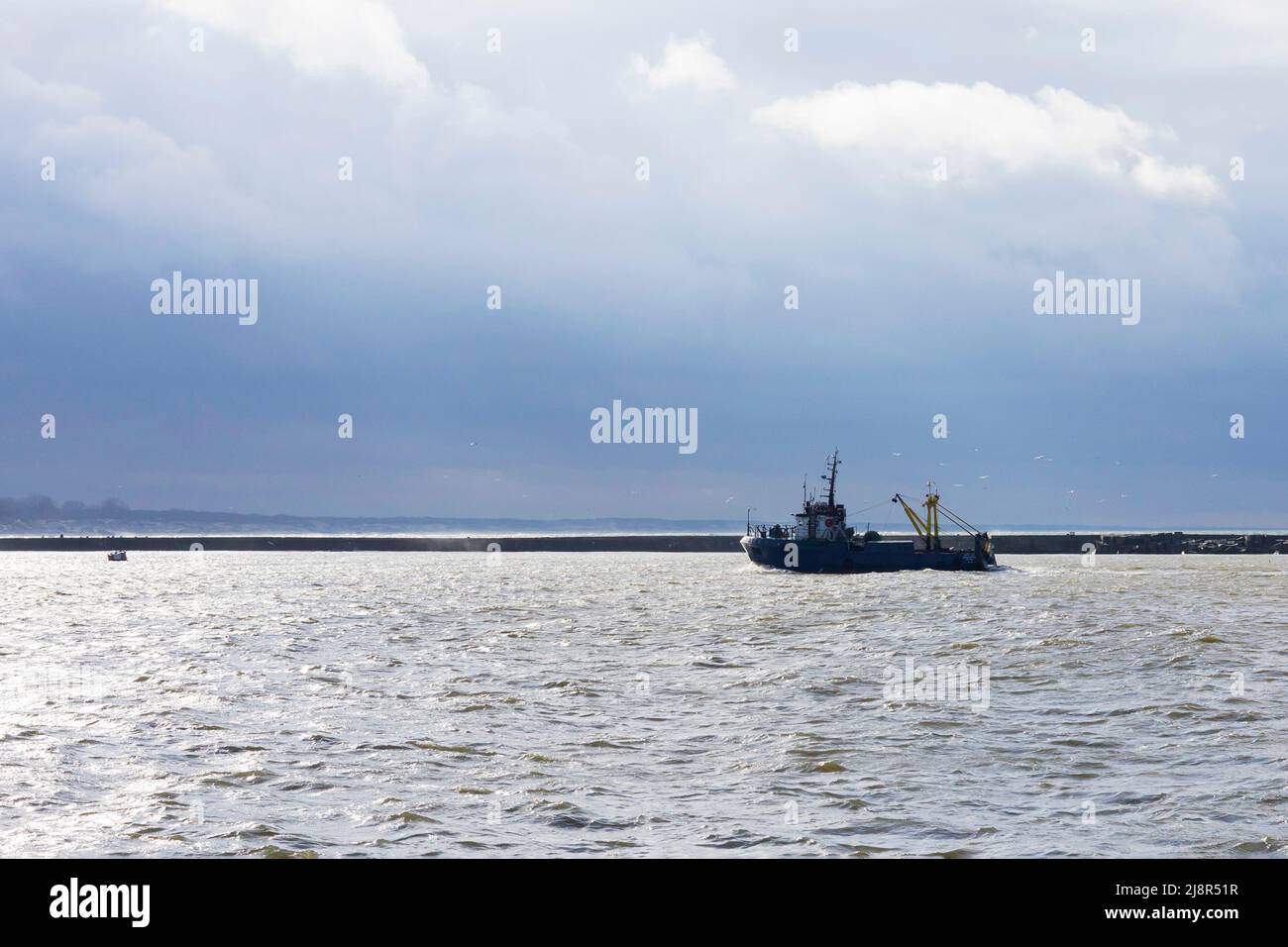 Fishing ship returns to port, fish catch, storm, bad weather Stock ...