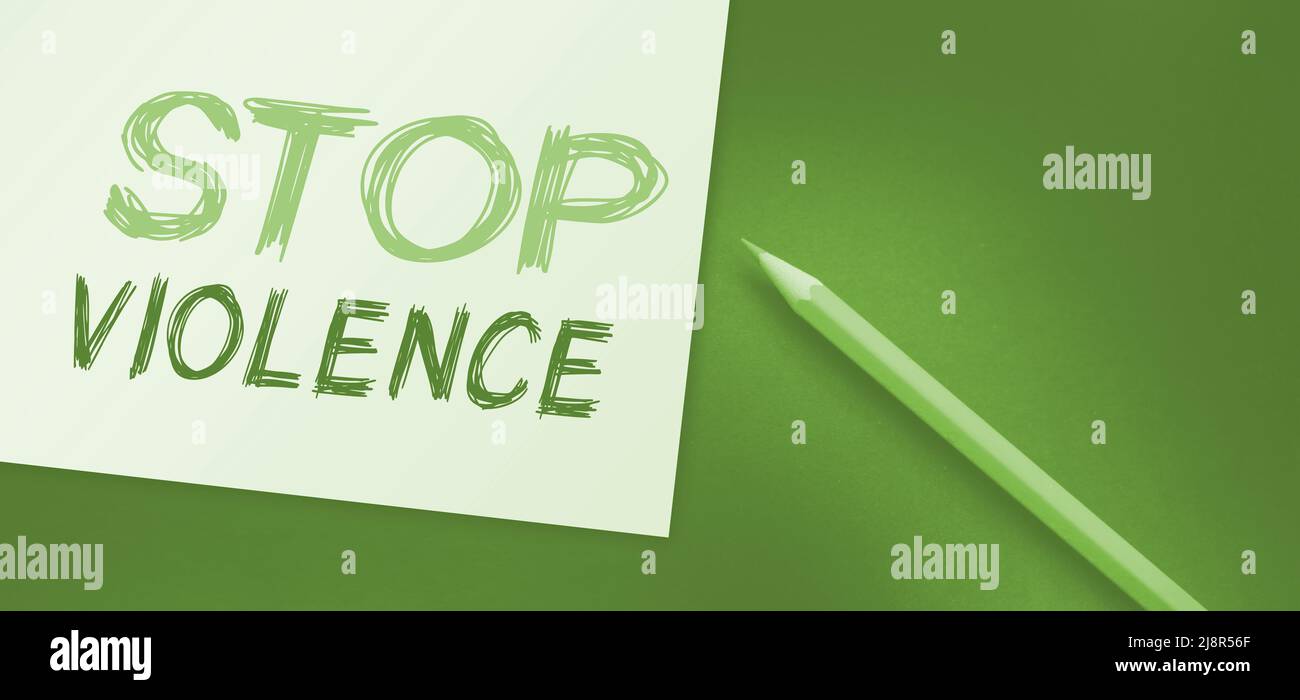 stop violence text write on paper with orange pencil. No discrimination ...
