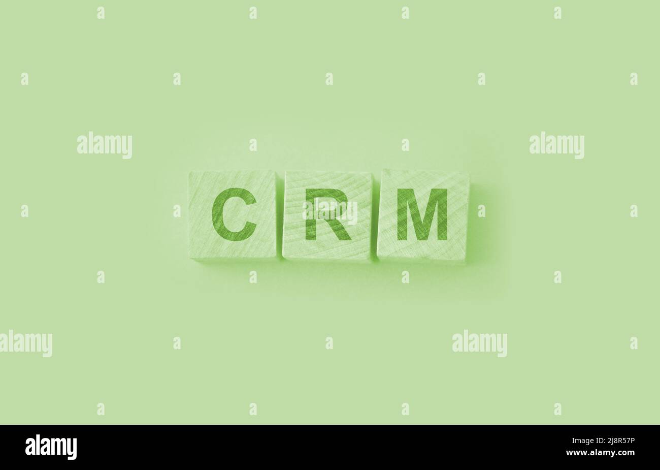 CRM Customer Relationship Marketing written on a wooden cubes. Business ...