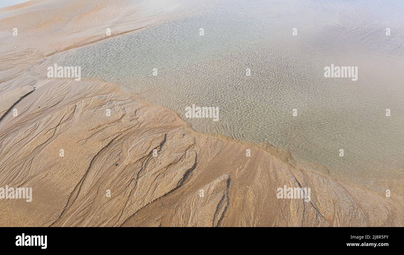 Patterns and textures of sea and sand Stock Photo - Alamy