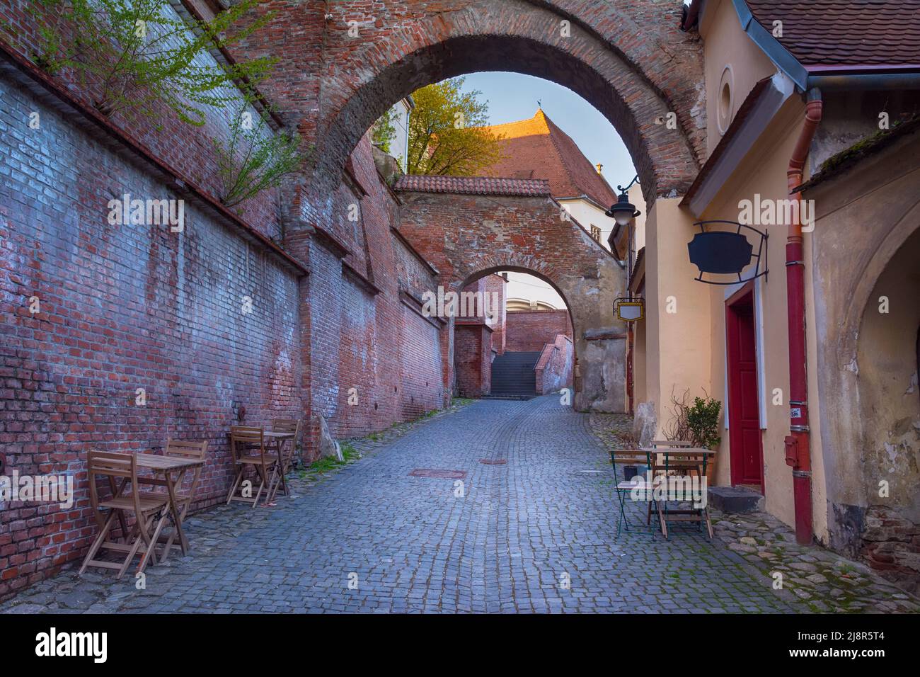 Cityscape with beautiful old buildings and arches in historical center ...