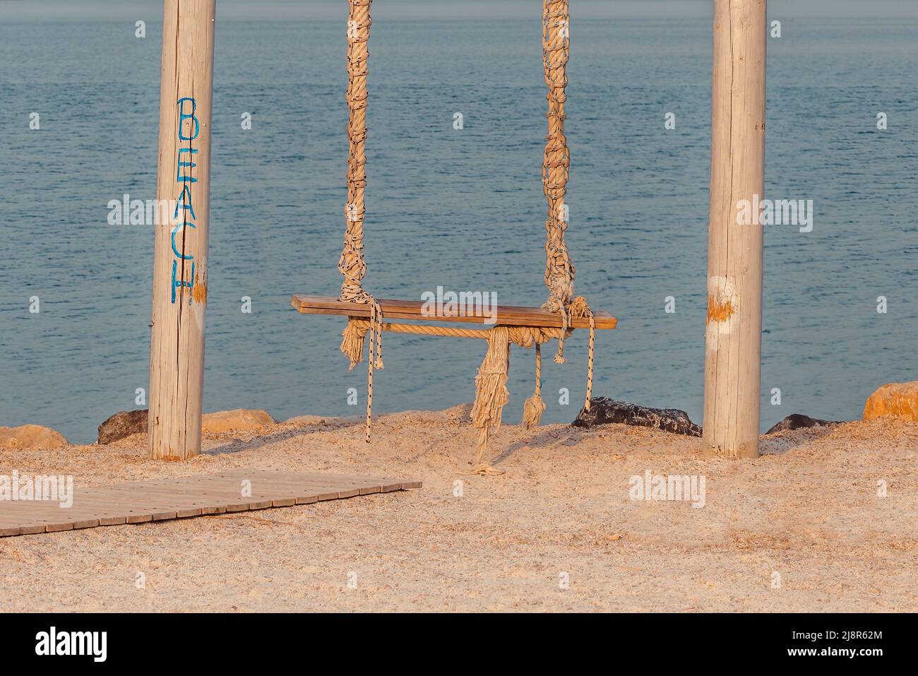 Beach swing at seaside coast in summer morning, Adriatic sea in ...