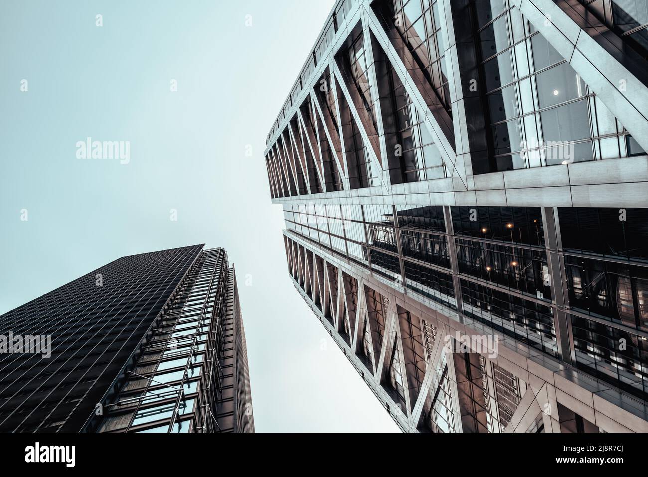 Urban landscape of steel and glass. Futuristic architecture and sky ...