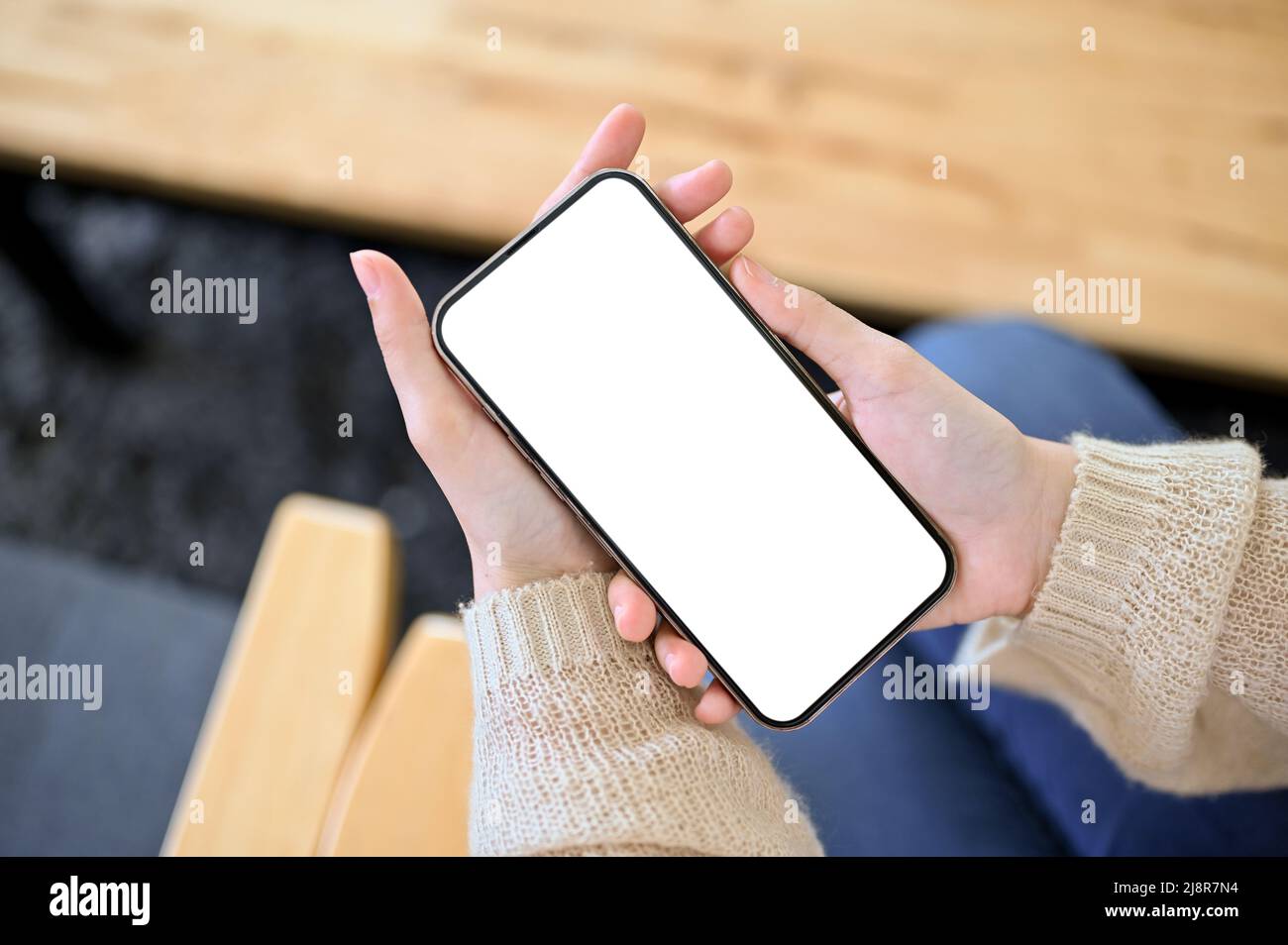 A cellphone white screen mockup for display your graphic banner is in a ...