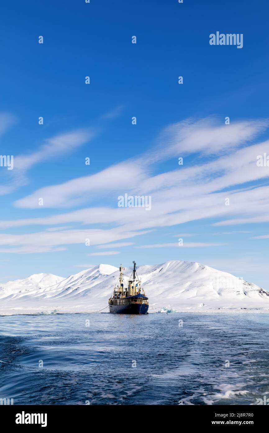Icebreaker at anchor in the arctic waters of Svalbard, a Norwegian ...