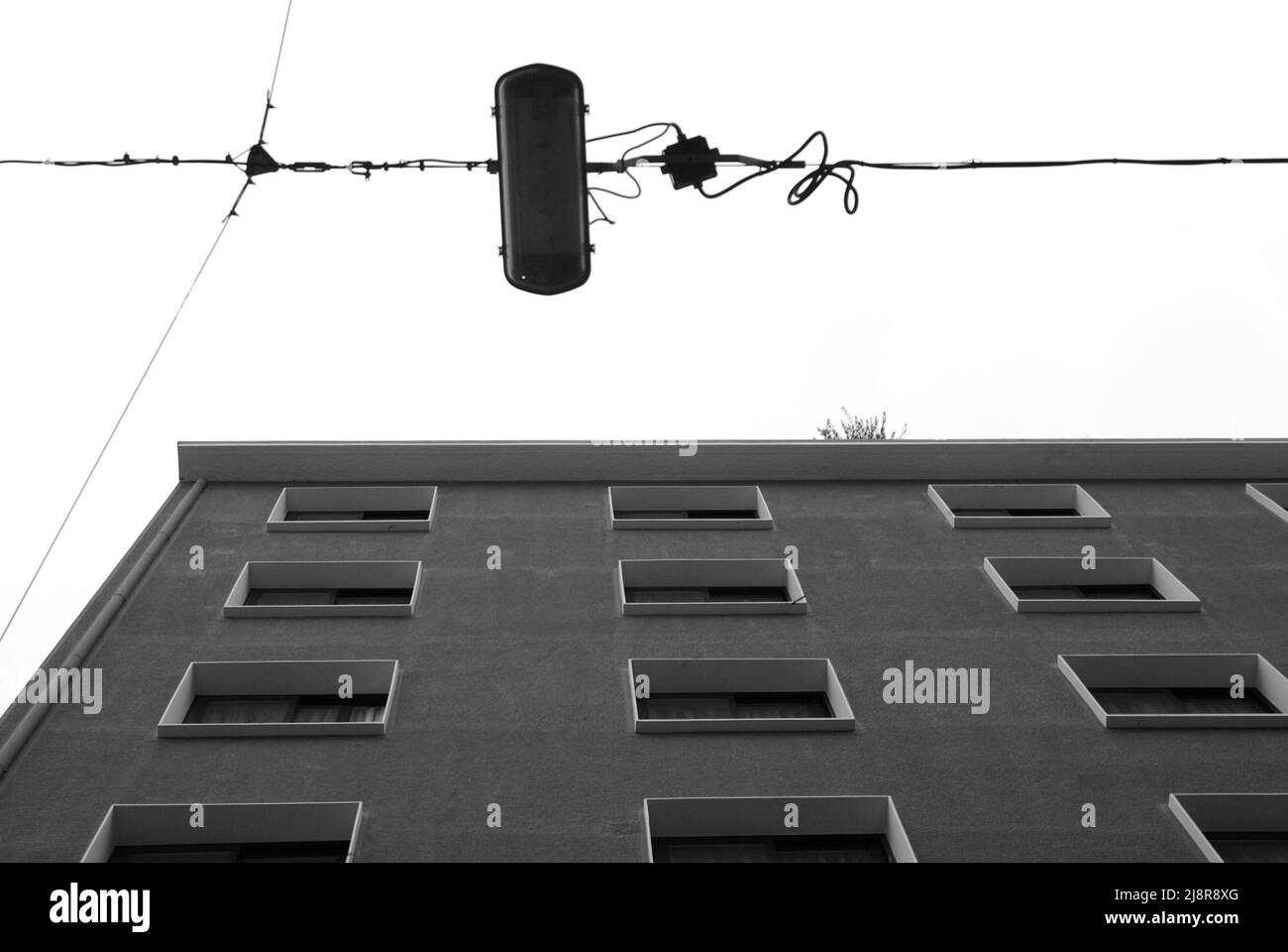 Black and white image of a building with beautiful windows and a street ...