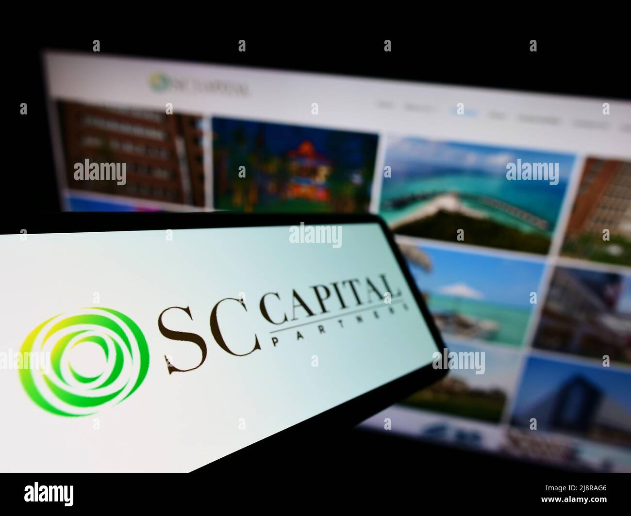 Cellphone with logo of real estate company SC Capital Partners Pte. Ltd ...