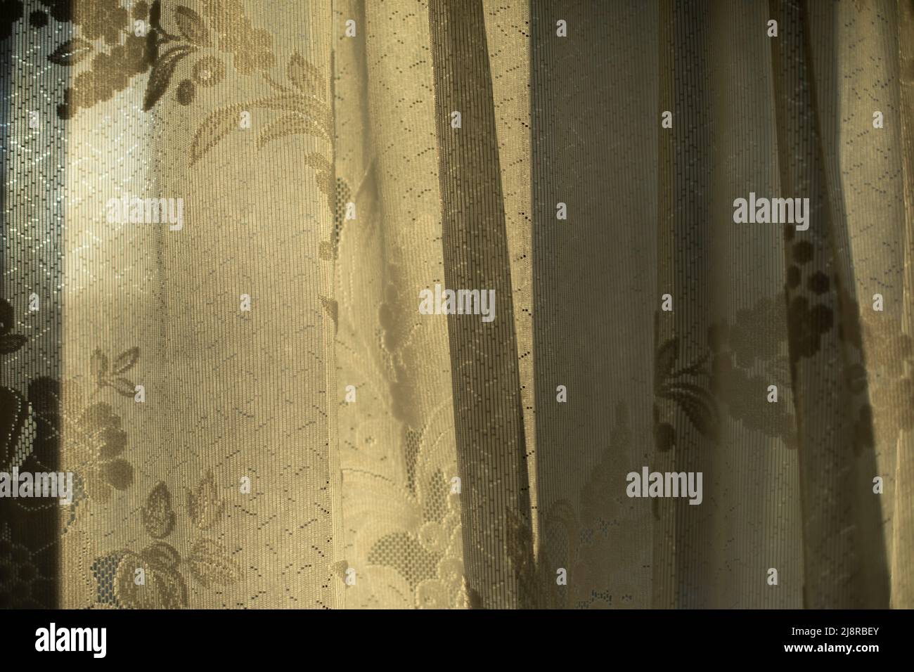 Curtains on window. Light through fabric. Morning sun in window of room ...