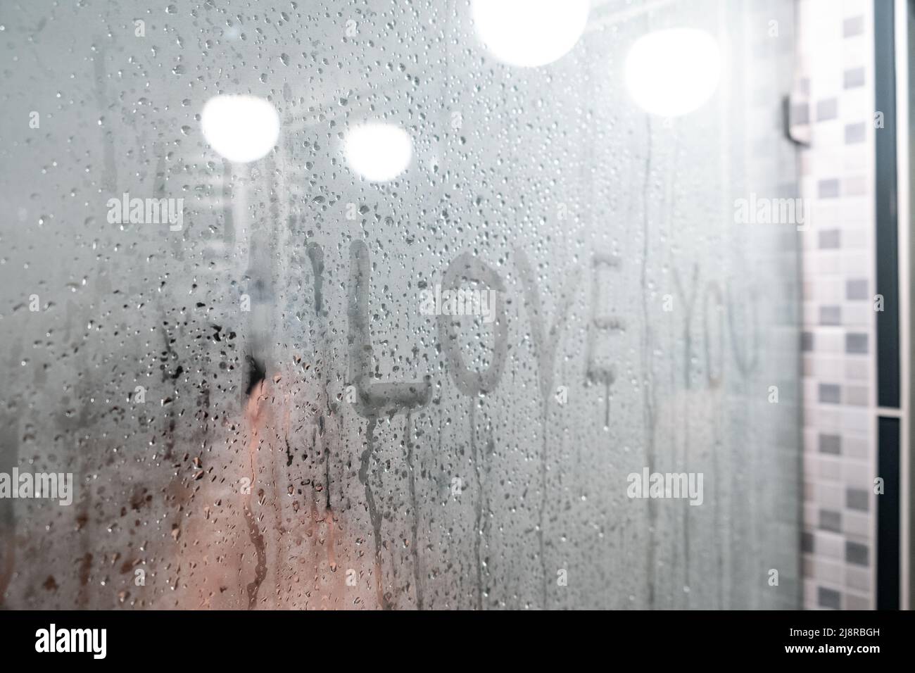 text I love you on shower glass copy space Stock Photo - Alamy