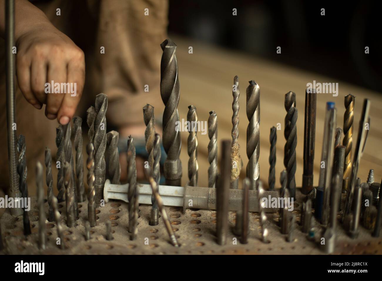 Drill bits for drills. Tools in garage. Drill bits in box. Production ...