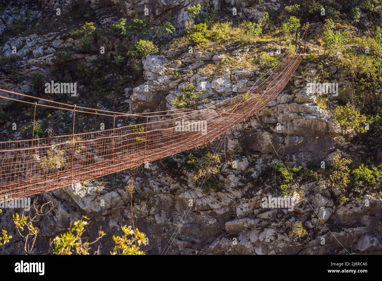Sights of Montenegro. Landmark Old rusty bridge. Attraction Long ...