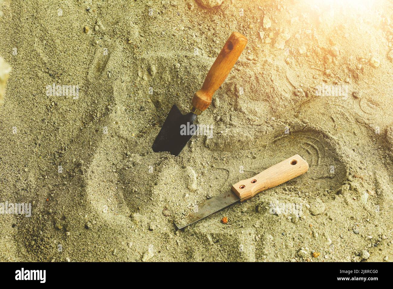 Shovel in the sand.Skeleton and archaeological tools.Digging for fossils. High quality photo ...