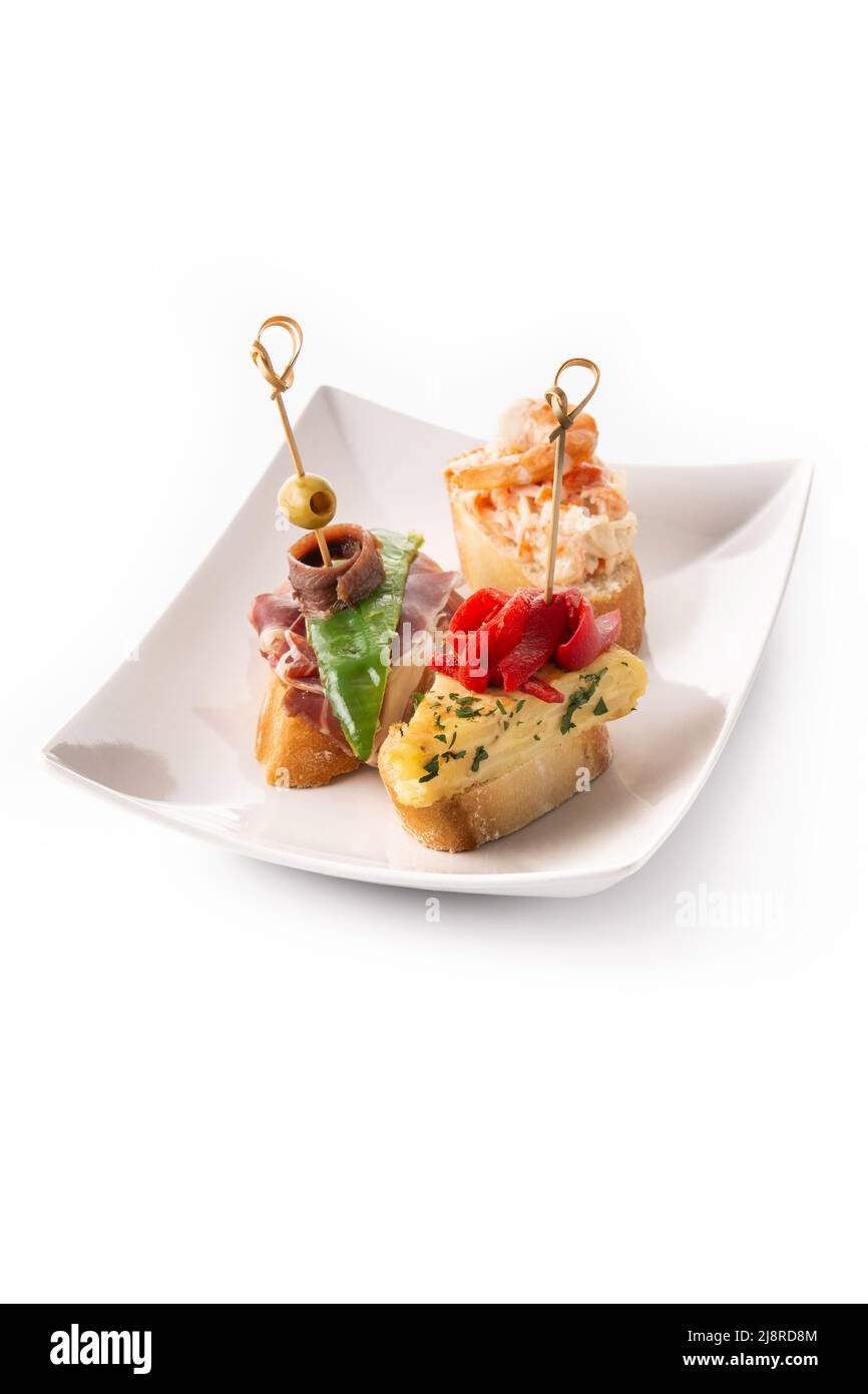 Assortment of Spanish pintxos isolated on white background Stock Photo ...
