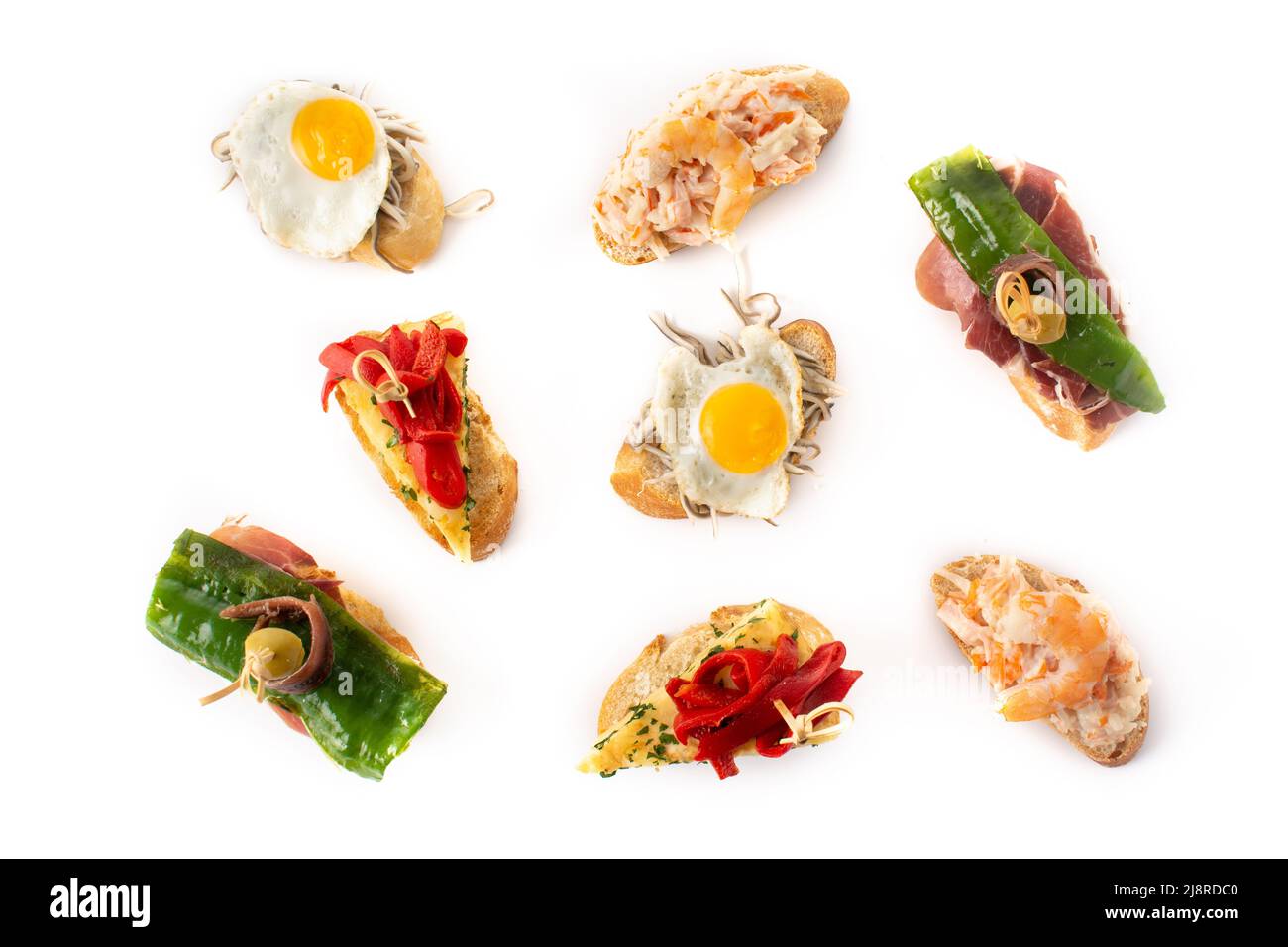 Assortment of Spanish pintxos isolated on white background Stock Photo ...
