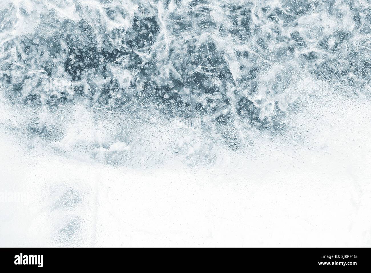 ice texture with cracks and patterns. winter background Stock Photo - Alamy