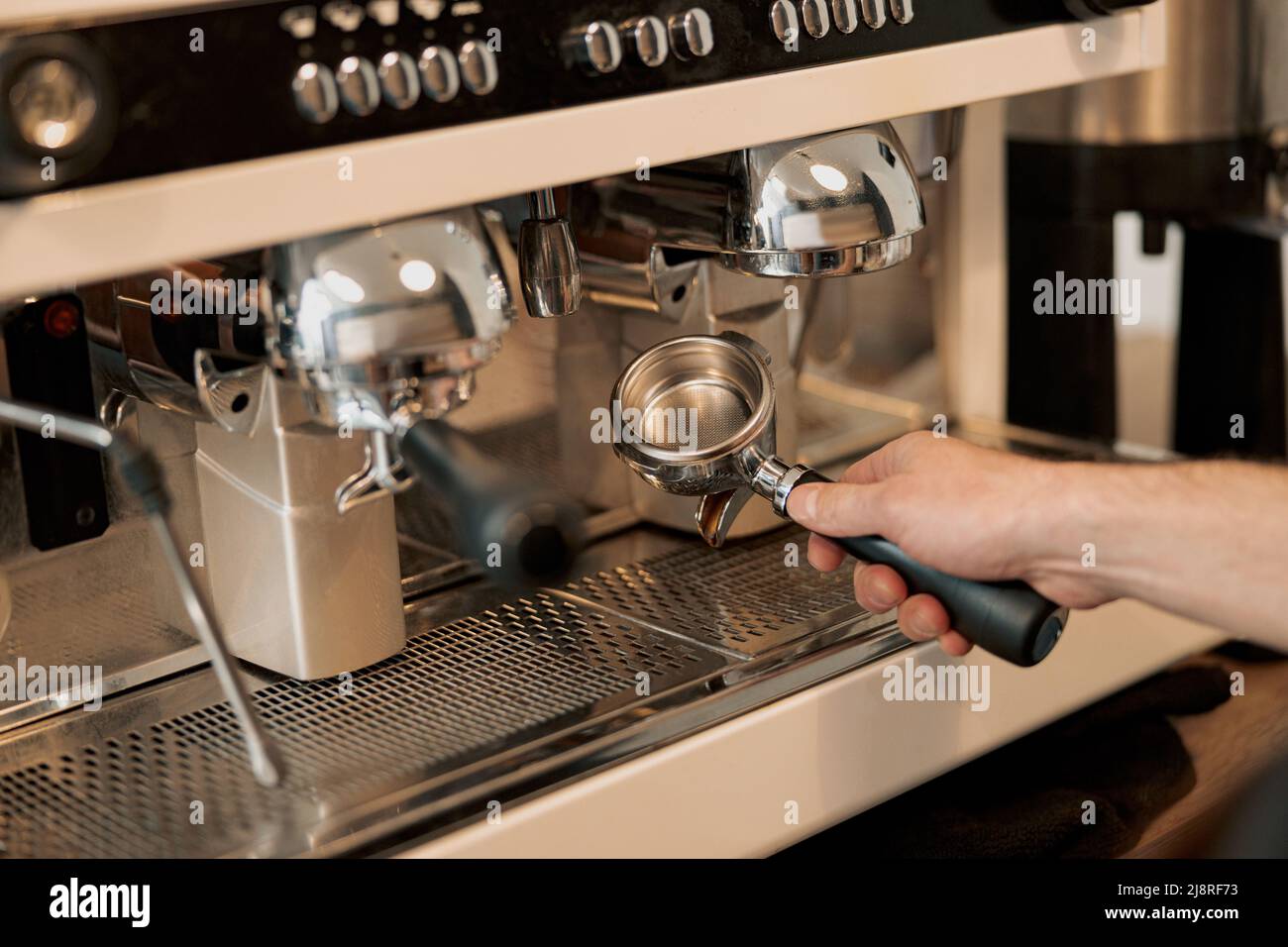 Photo of the process of installing portafilter in coffee machine Stock ...