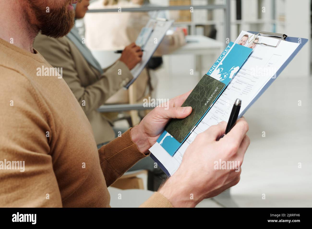 Unrecognizable Caucasian man waiting in queue to consular officer ...