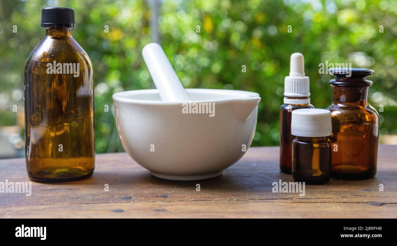 Natural pharmacy and homeopathy products. White mortar and pestle and ...