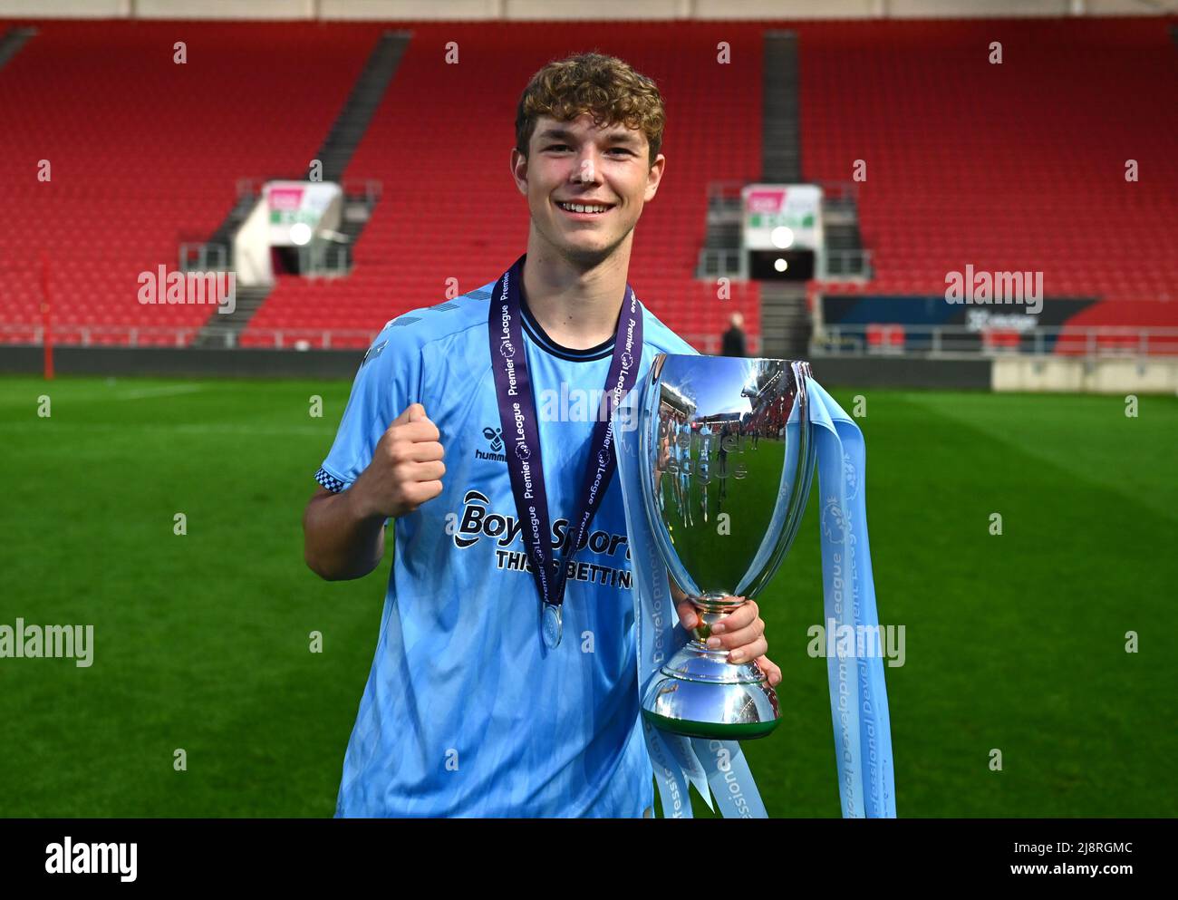 Coventry City's Charlie Manners celebrates with the trophy after ...