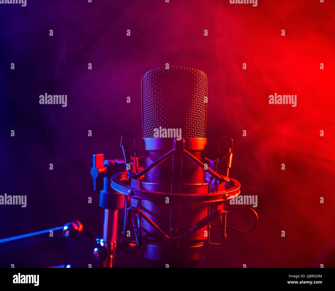Professional microphone in pink smoke on a black background Stock Photo ...