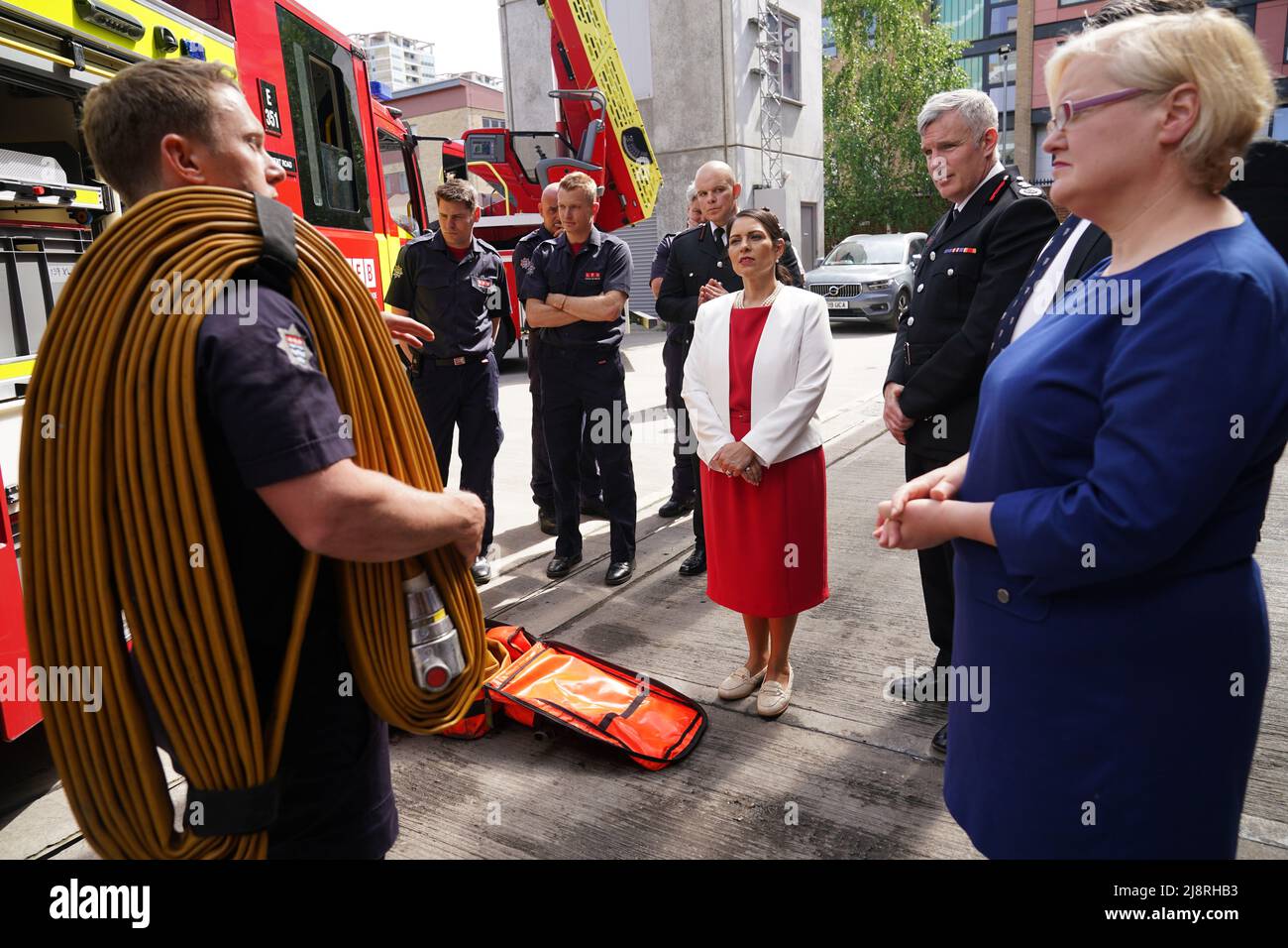 Home Secretary Priti Patel (centre) is shown equipment with London Fire ...