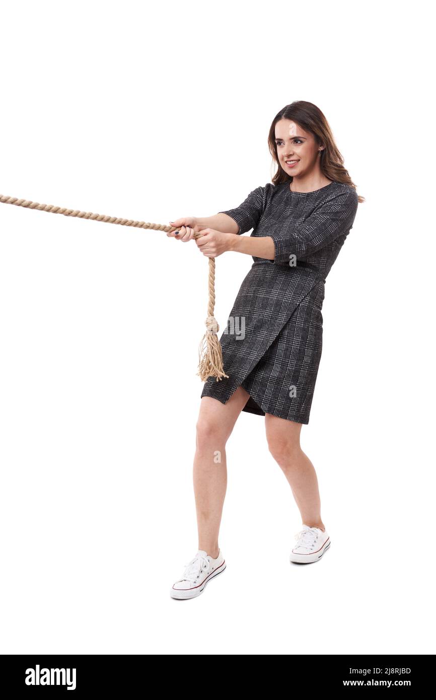 Young businesswoman pulling a heavy weight, useful in digital ...