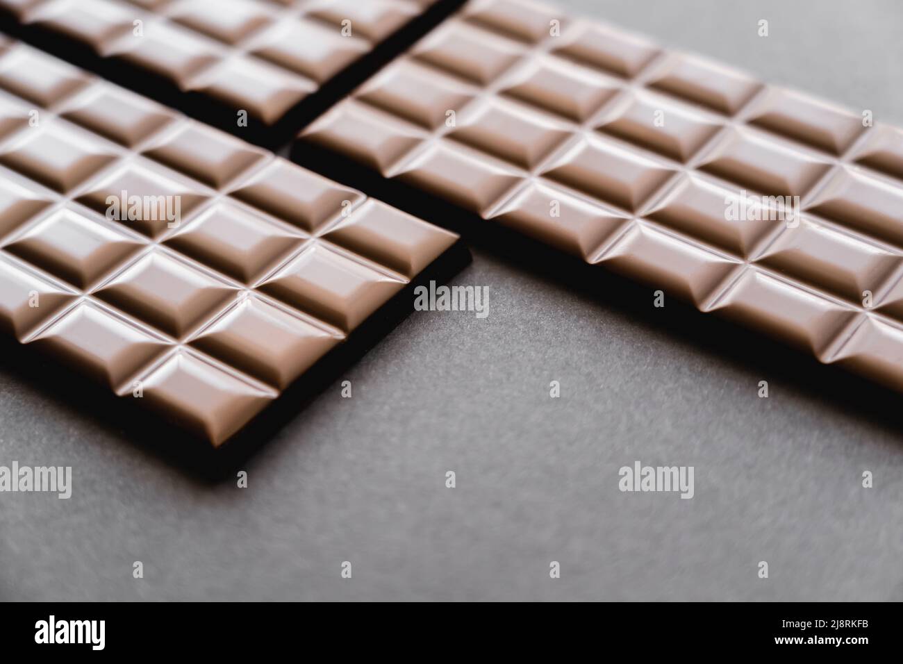 Close up view of natural chocolate bars on black surface Stock Photo ...