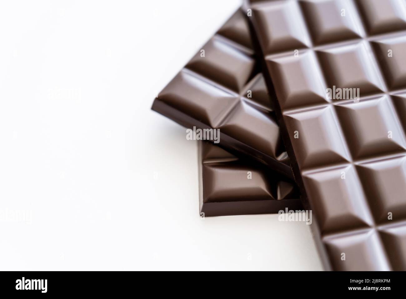Close up view of chocolate bars on white background Stock Photo - Alamy