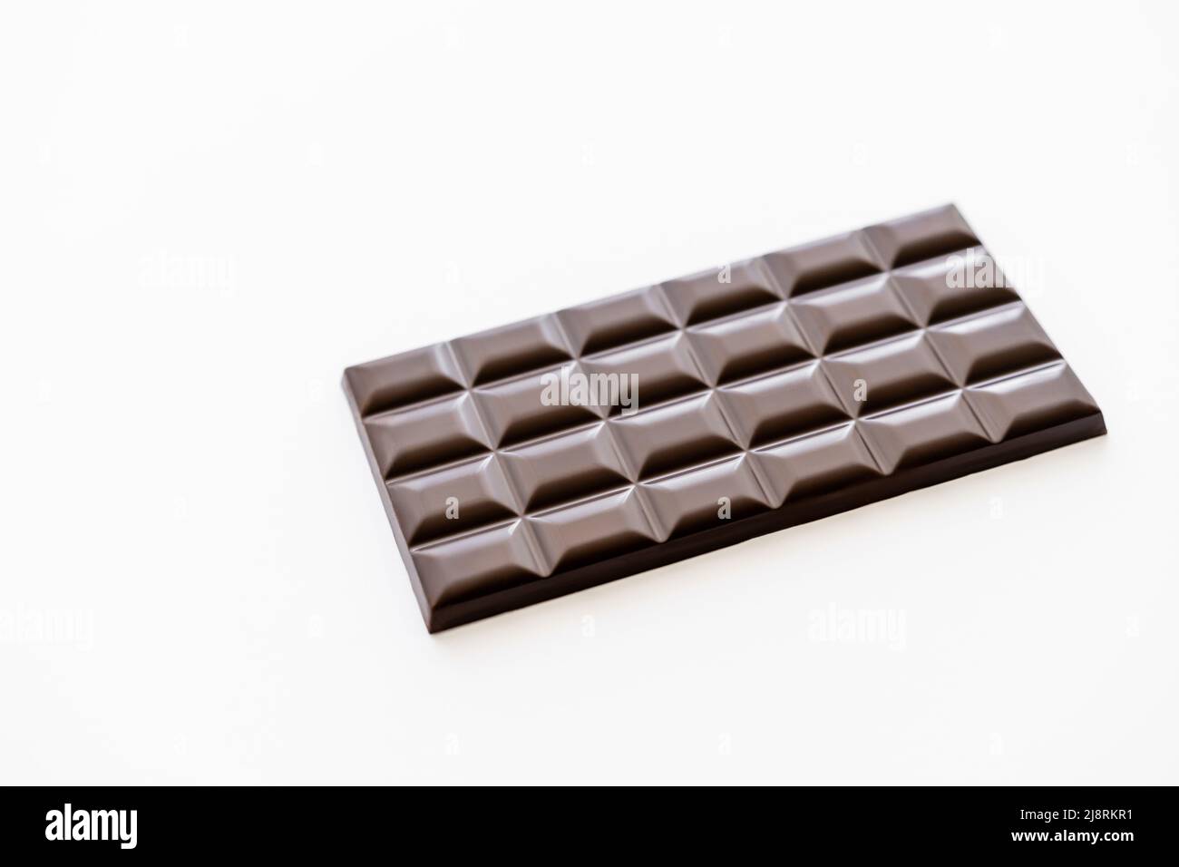 High angle view of brown chocolate bar isolated on white Stock Photo ...