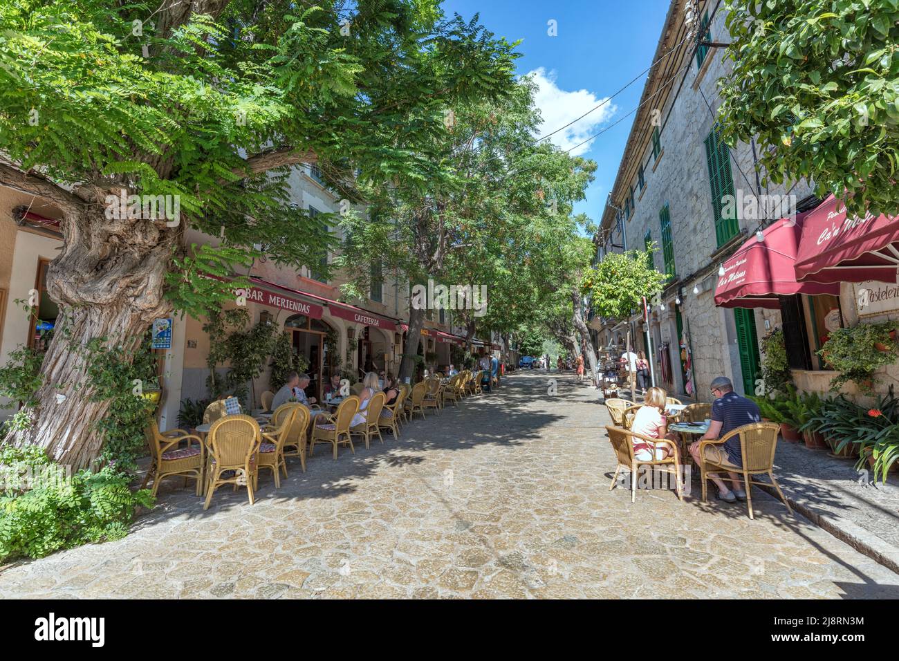 Restaurants in Via Blanquerna a tree lined cobbled street with shops ...