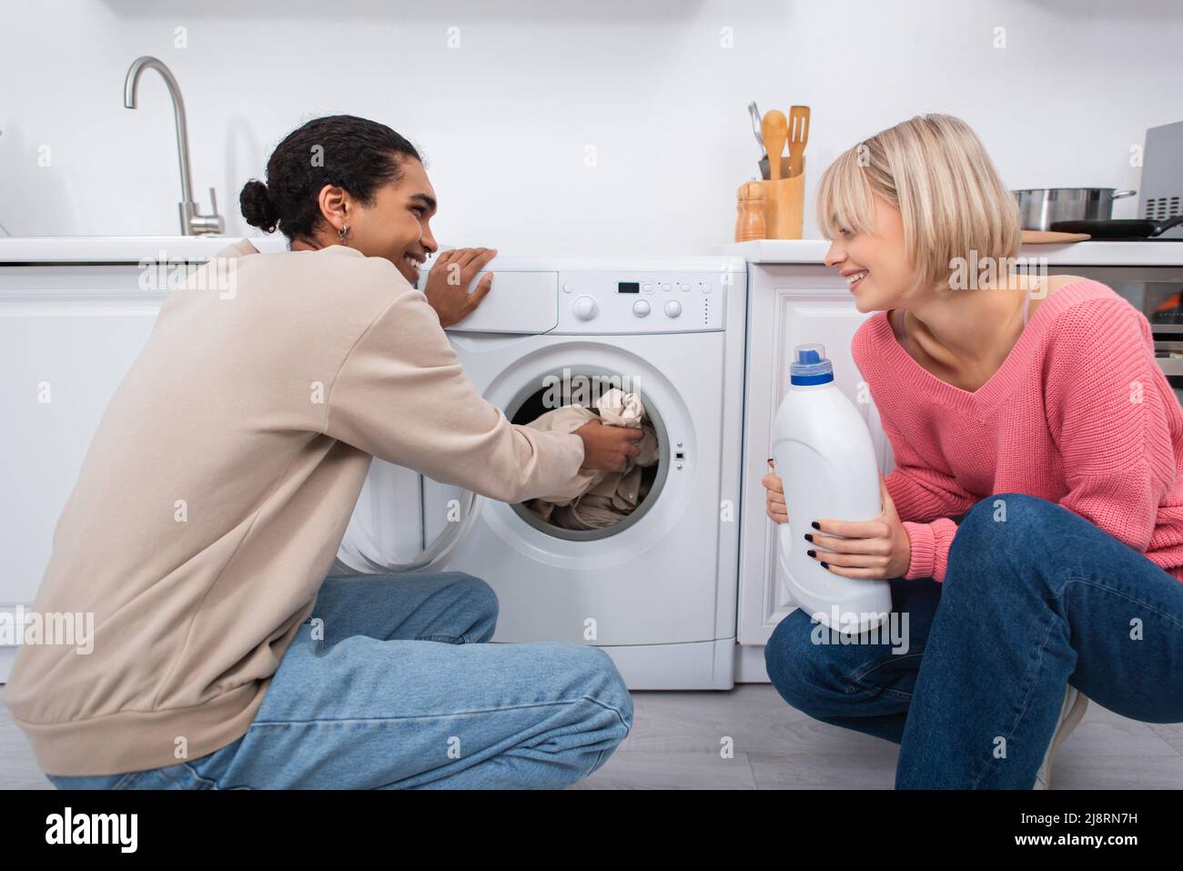 American woman washing clothes hi-res stock photography and images - Alamy