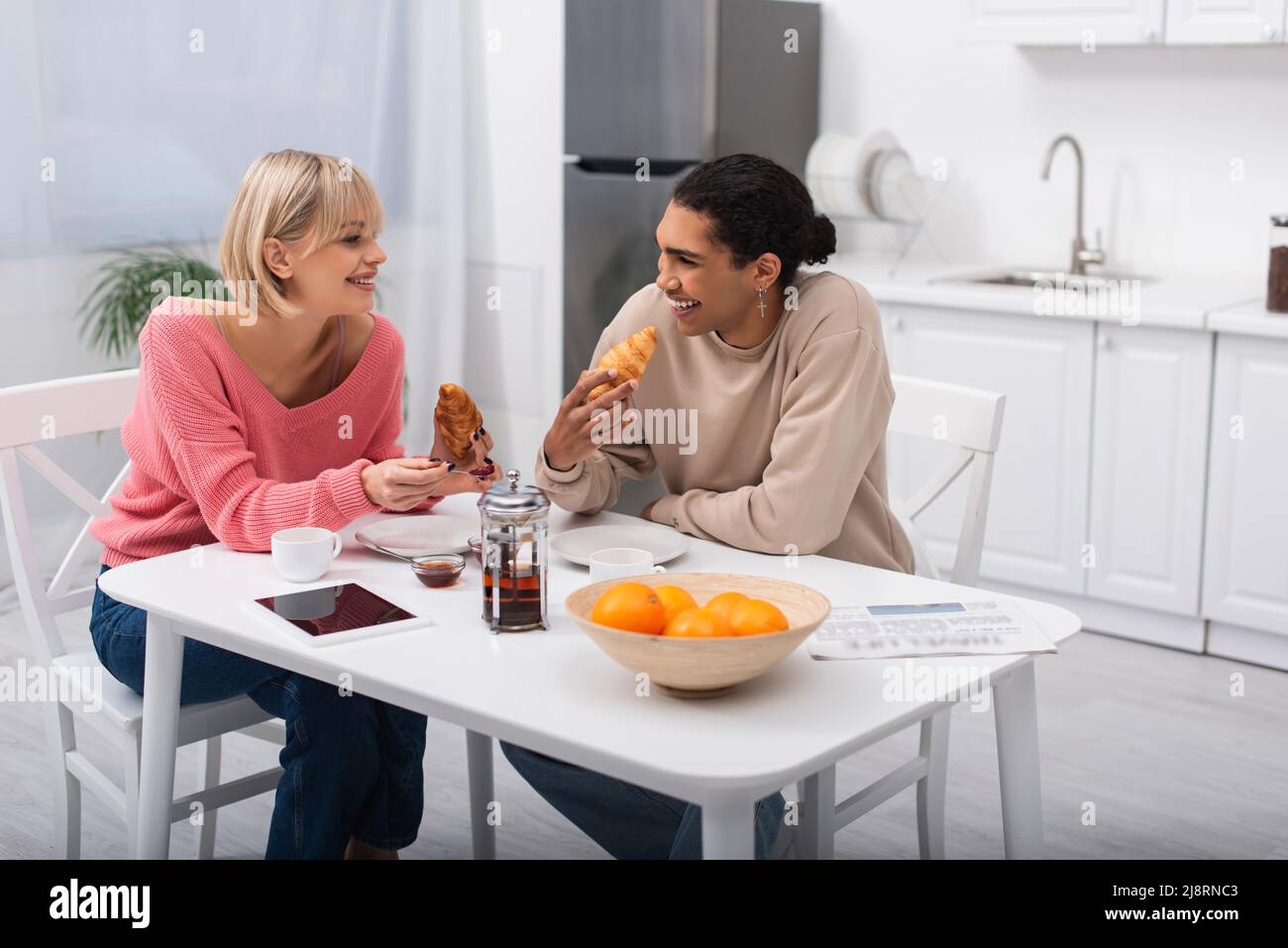 Attractive young man eating breakfast hi-res stock photography and ...