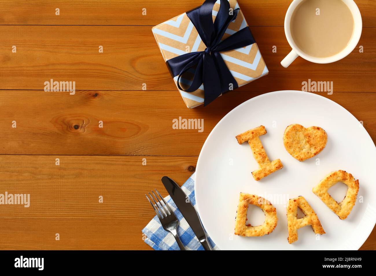 Happy Fathers Day table with cookies I love Dad, gift box, cup of ...