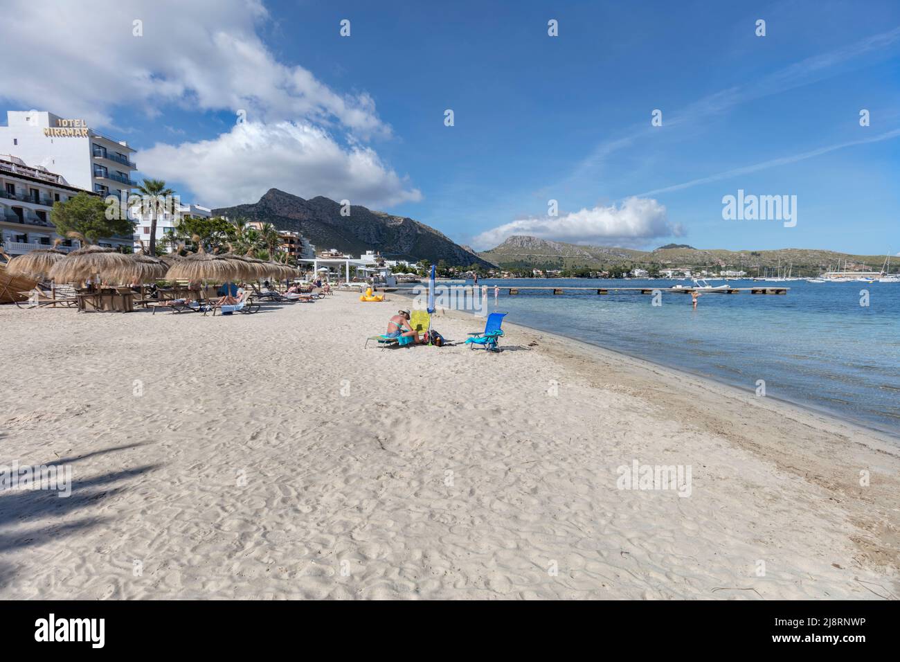 Port de Pollenca - beach and hotels by the crystal clear aquamarine ...