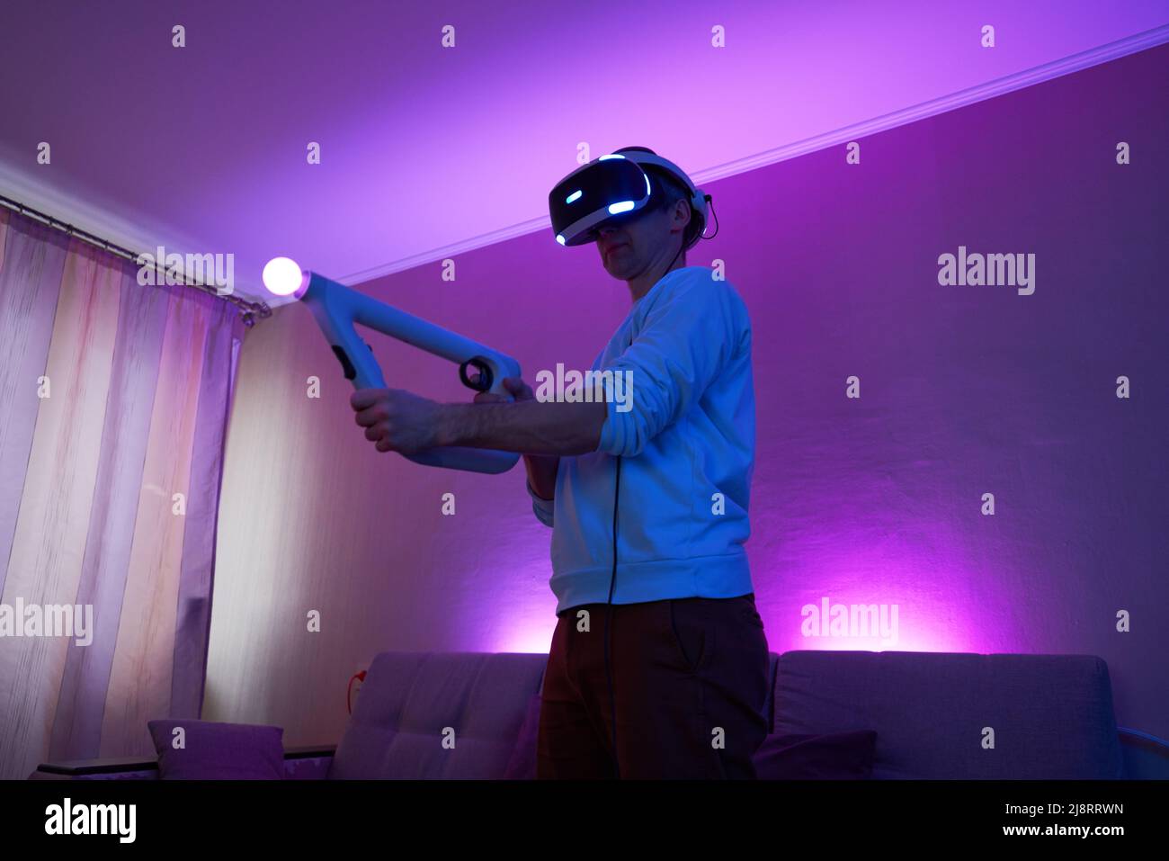 Man with virtual reality headset and joystic is playing game Concept of ...