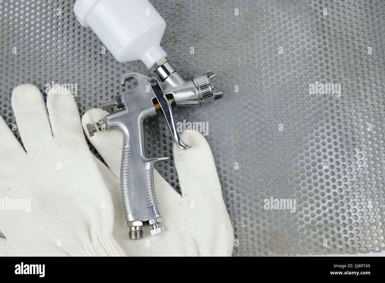 paint spray gun at work at the workplace in the workshop Stock Photo ...