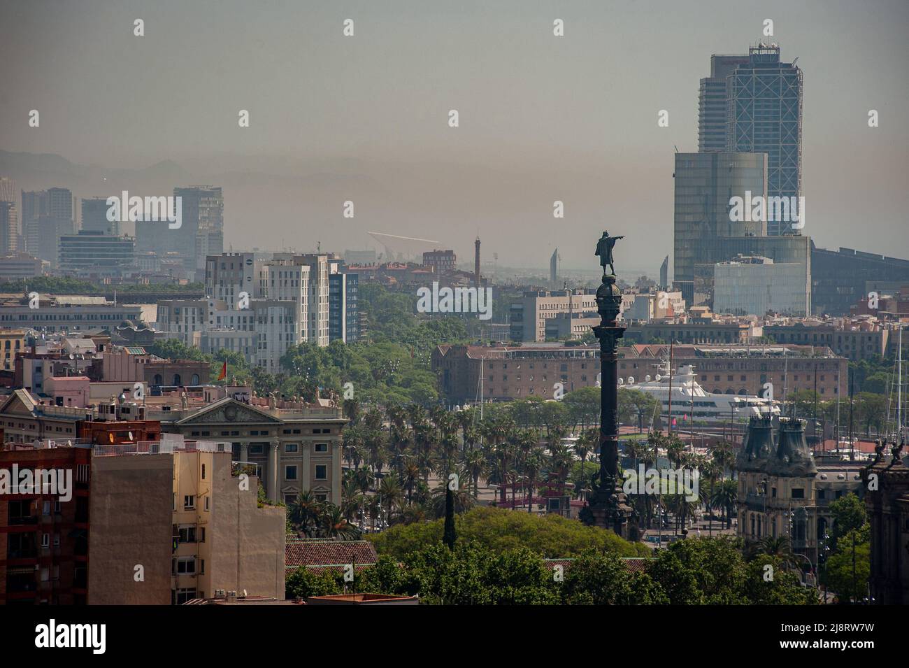 The statue of Columbus is seen with the haze over the city of Barcelona ...