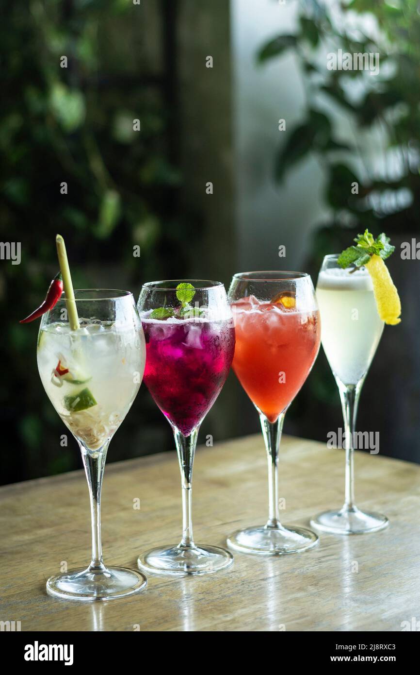 mixed spritzer wine cocktails selection with fruit in outdoor bar table ...