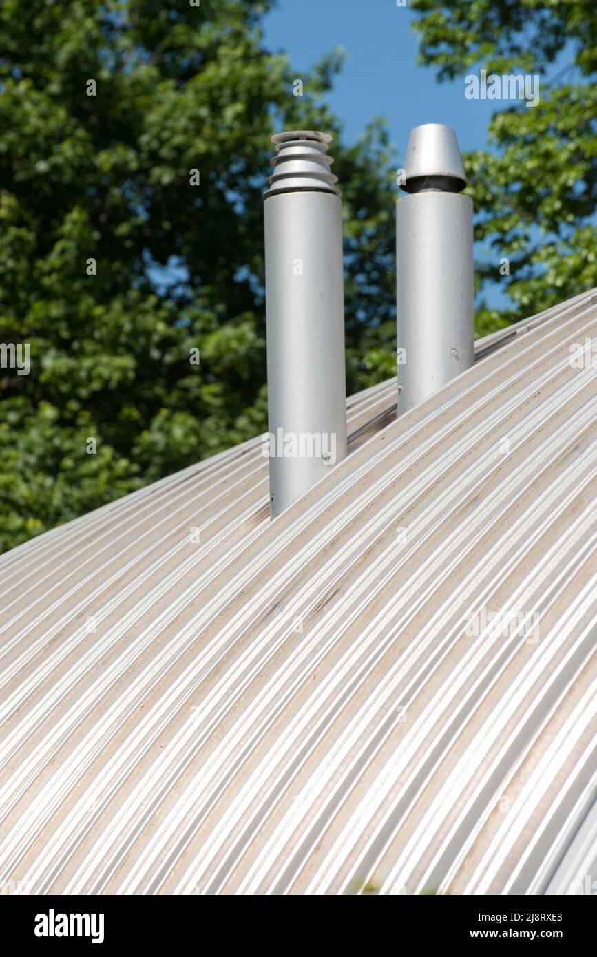 Round metal chimneys Stock Photo - Alamy